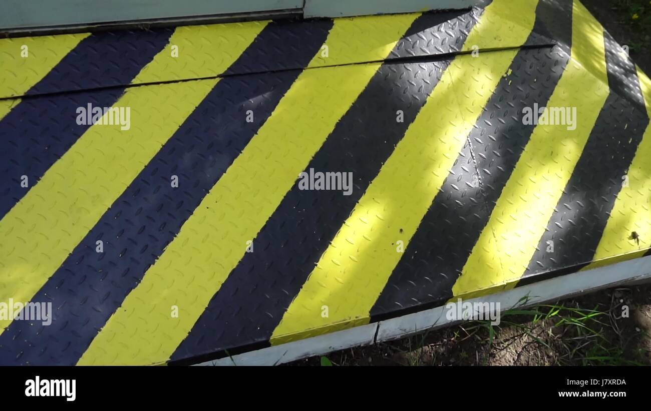 Black and yellow danger warning sign. Attention Stock Photo - Alamy