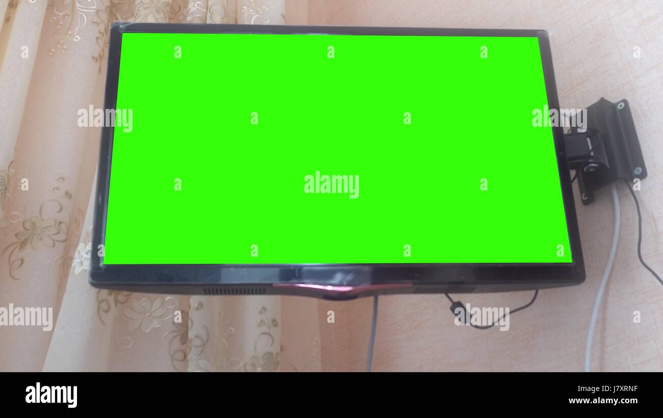 Dolly Move Into a Big Screen TV With Greenscreen Stock Photo - Alamy