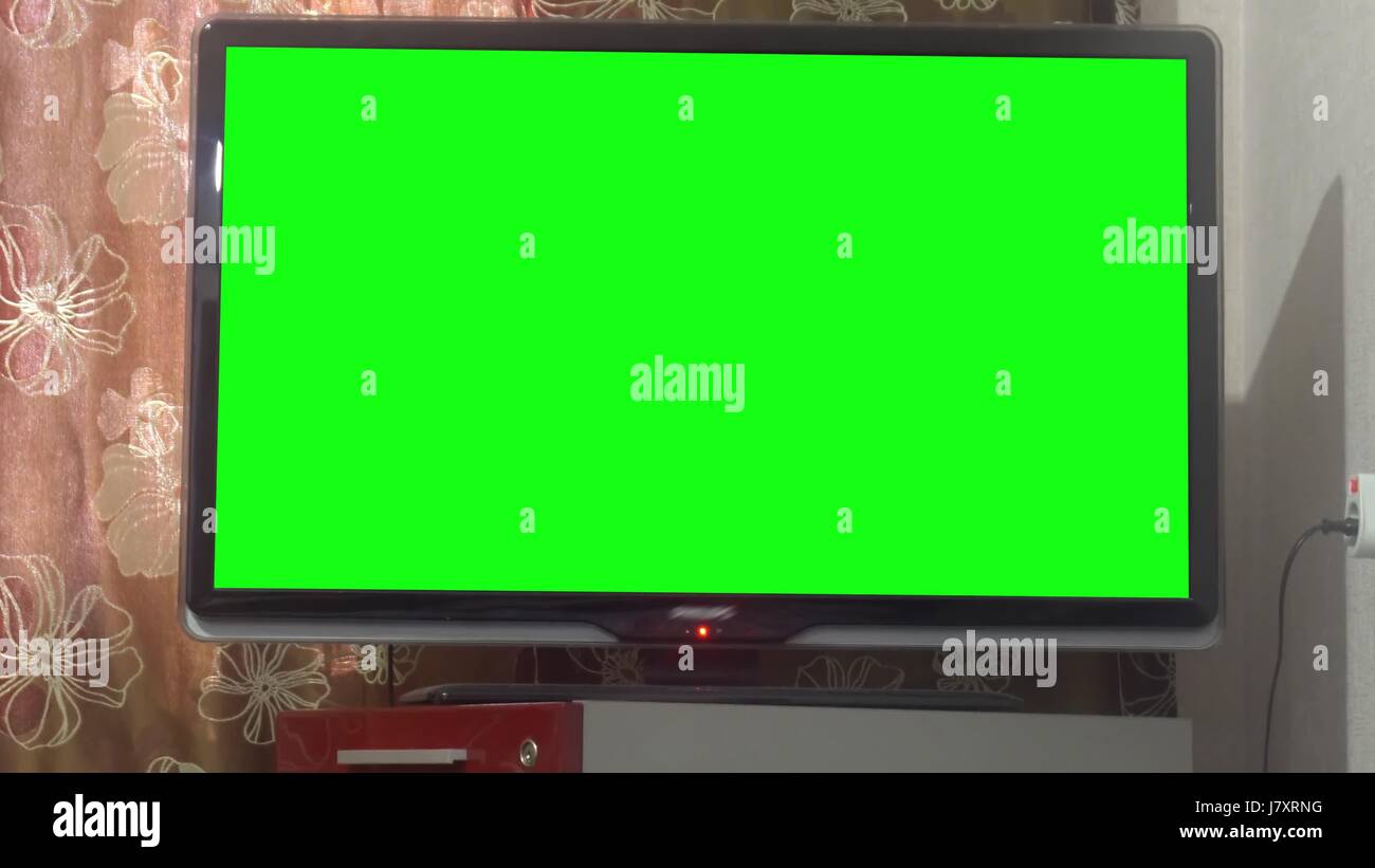 Dolly Move Into a Big Screen TV With Greenscreen Stock Photo - Alamy