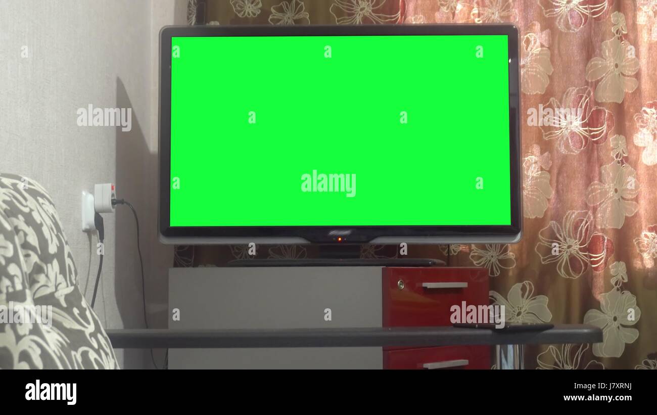 Dolly Move Into a Big Screen TV With Greenscreen Stock Photo - Alamy