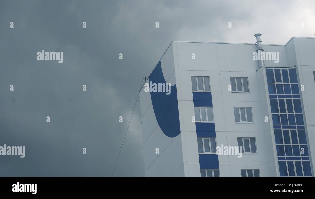skyscraper on the background of the rainy clouds Stock Photo - Alamy