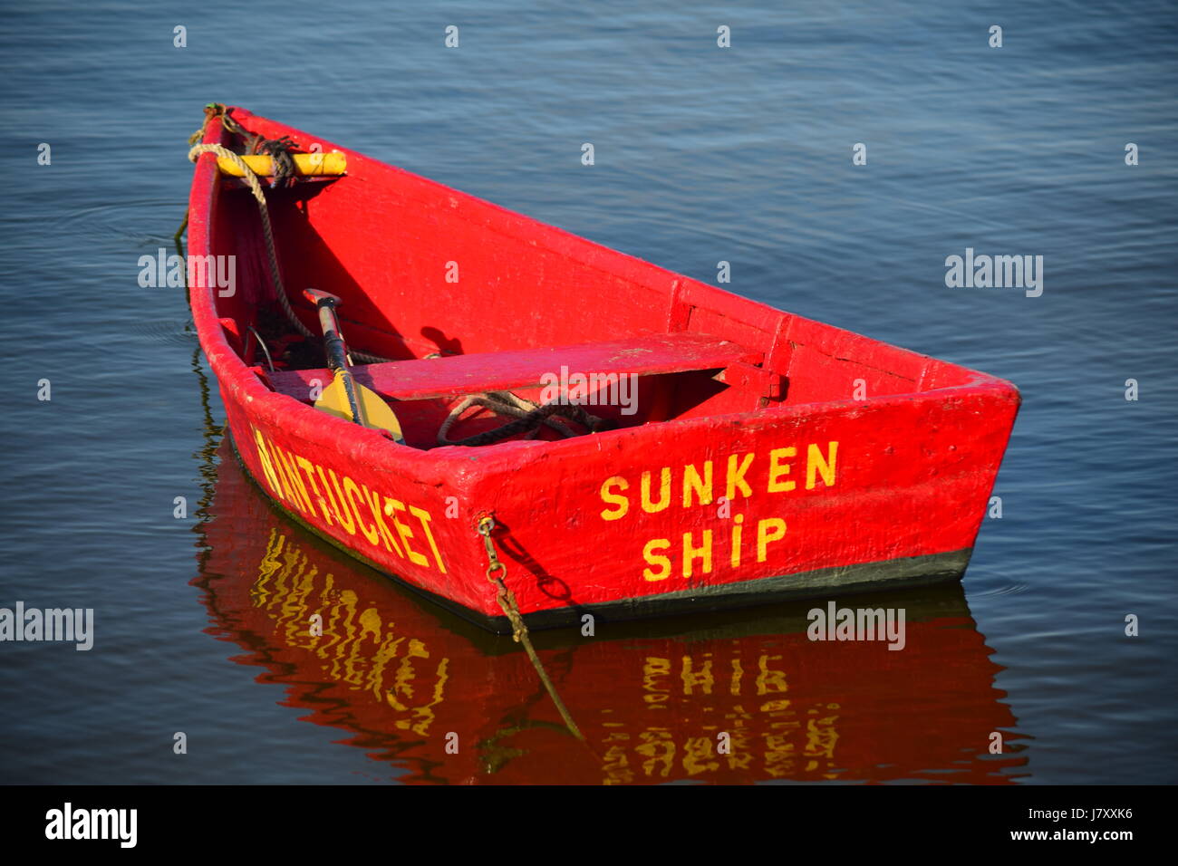 Red dinghy boat in the harbor in Nantucket, MA Stock Photo - Alamy