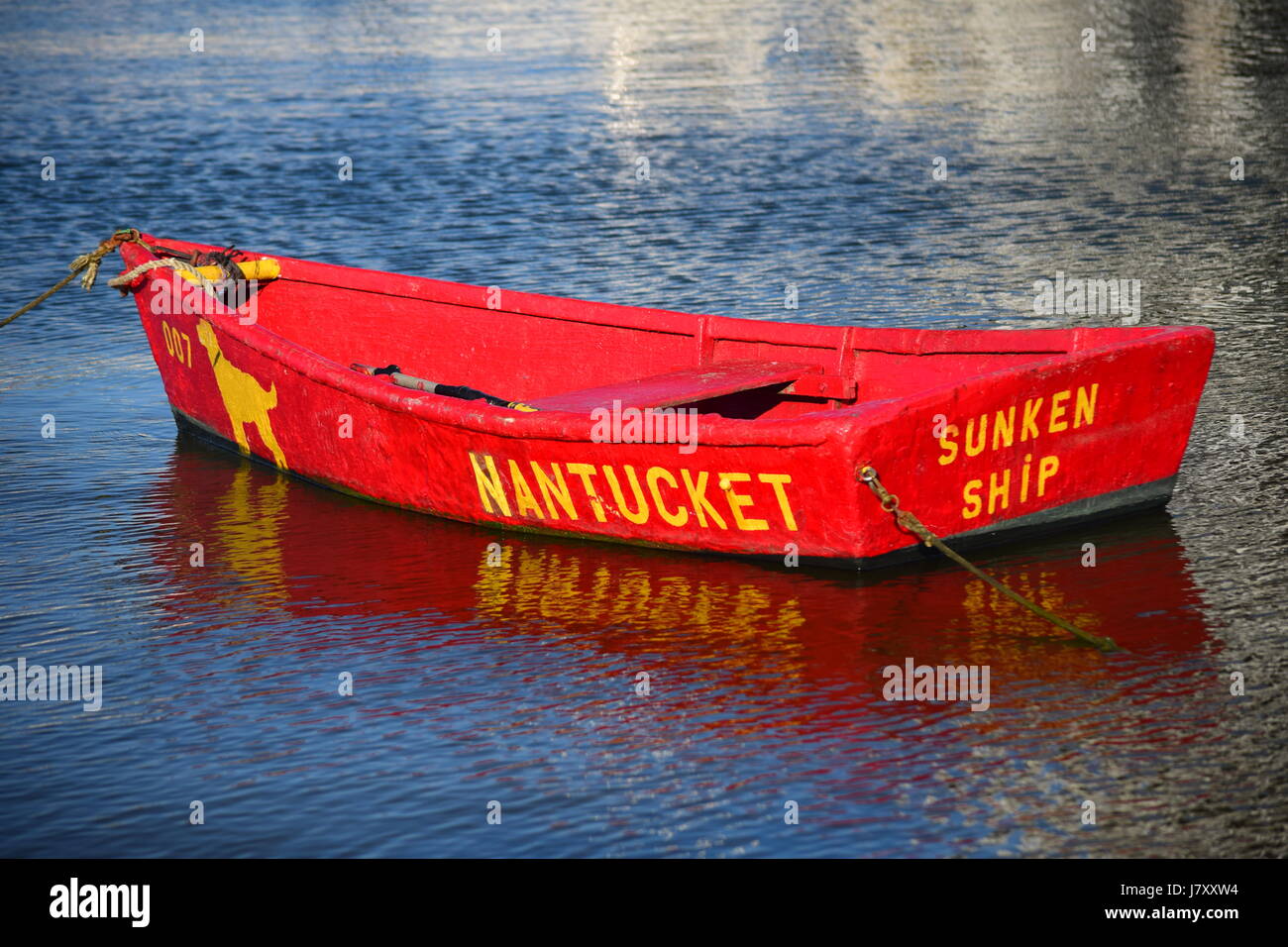 Red dinghy boat in the harbor in Nantucket, MA Stock Photo - Alamy