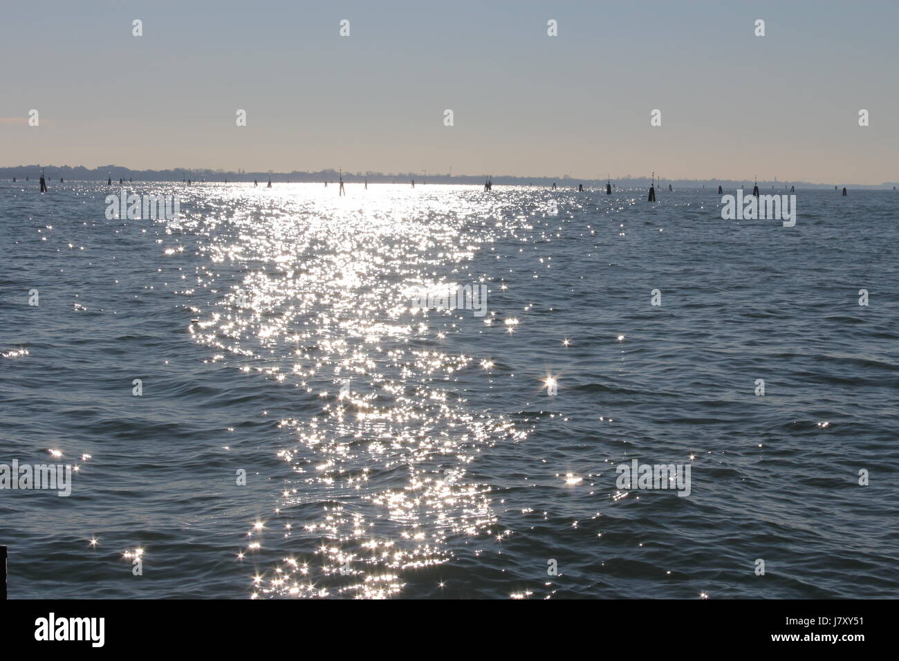 Sun glints off sea Stock Photo - Alamy
