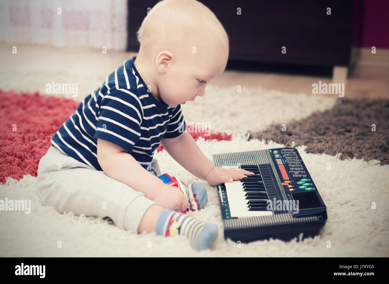 Child playing piano hi-res stock photography and images - Alamy