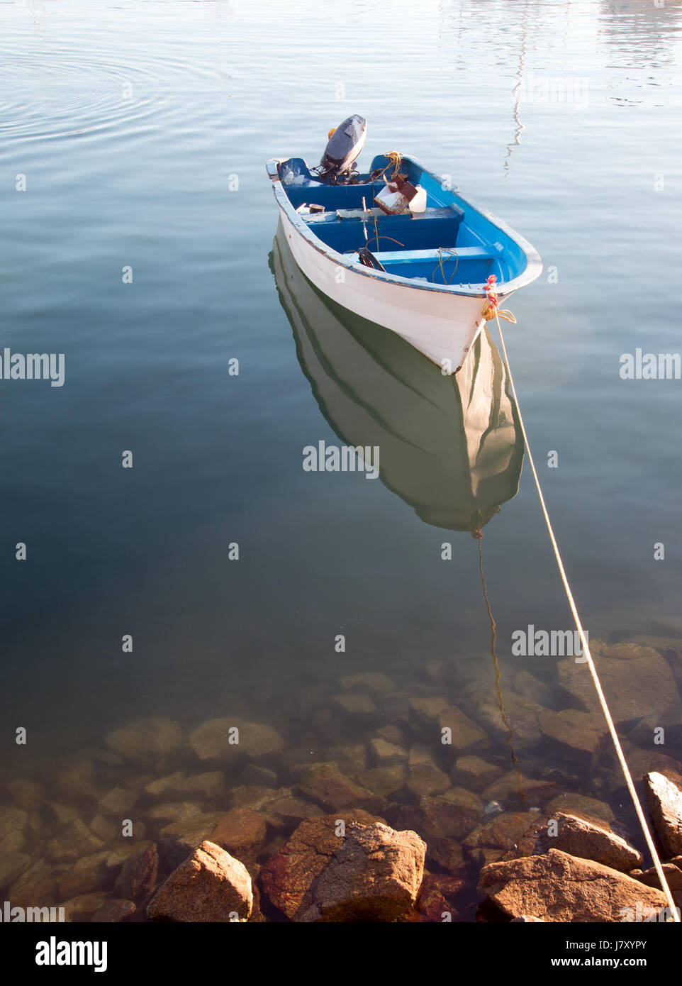 Small fishing boat anchored in Cabo San Lucas marina Stock Photo - Alamy