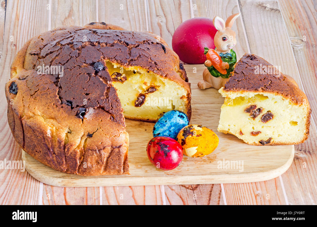 Traditional romanian cake called Pasca with colored easter eggs, bunny ...