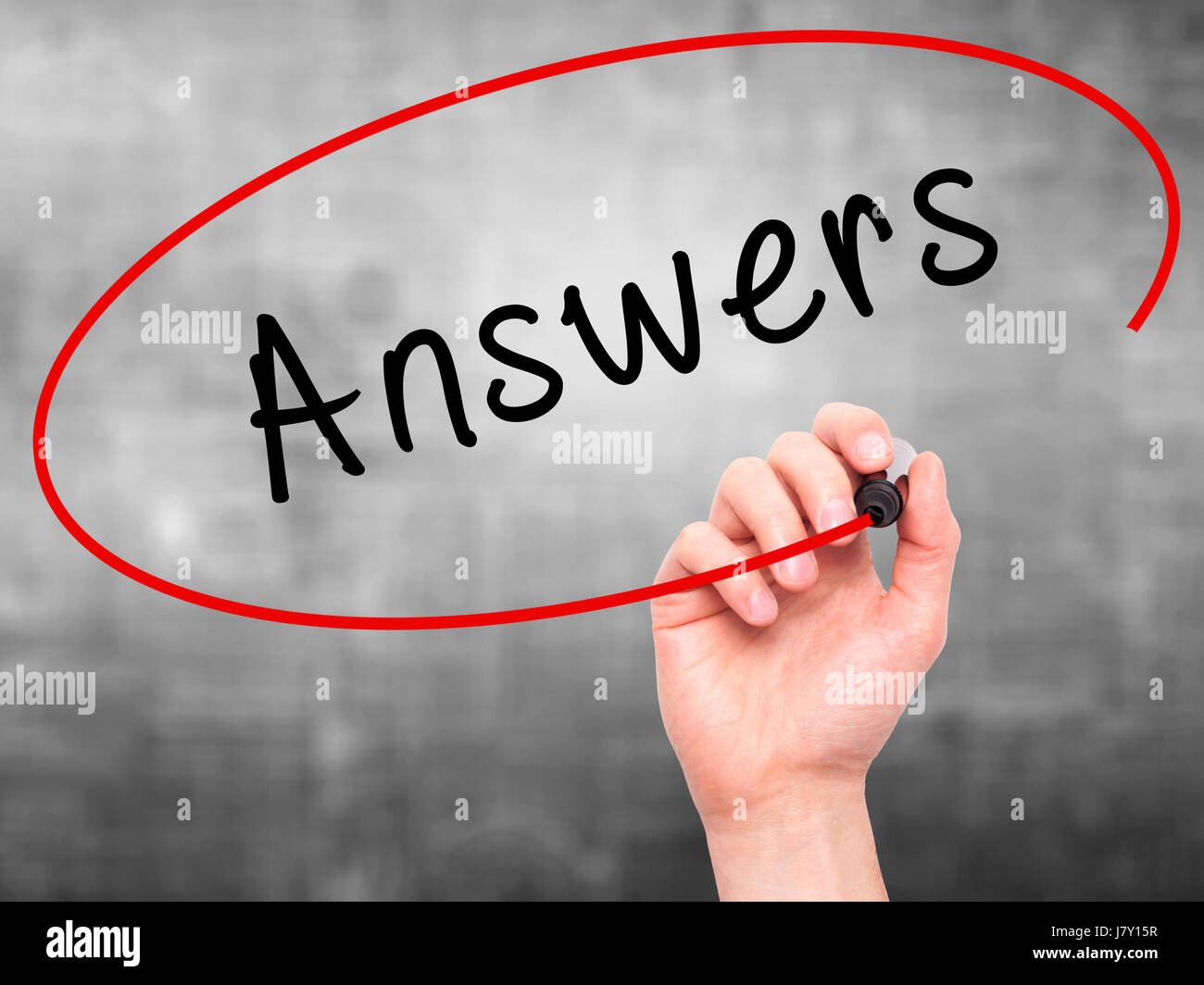 Man Hand writing Answers with marker on transparent wipe board ...