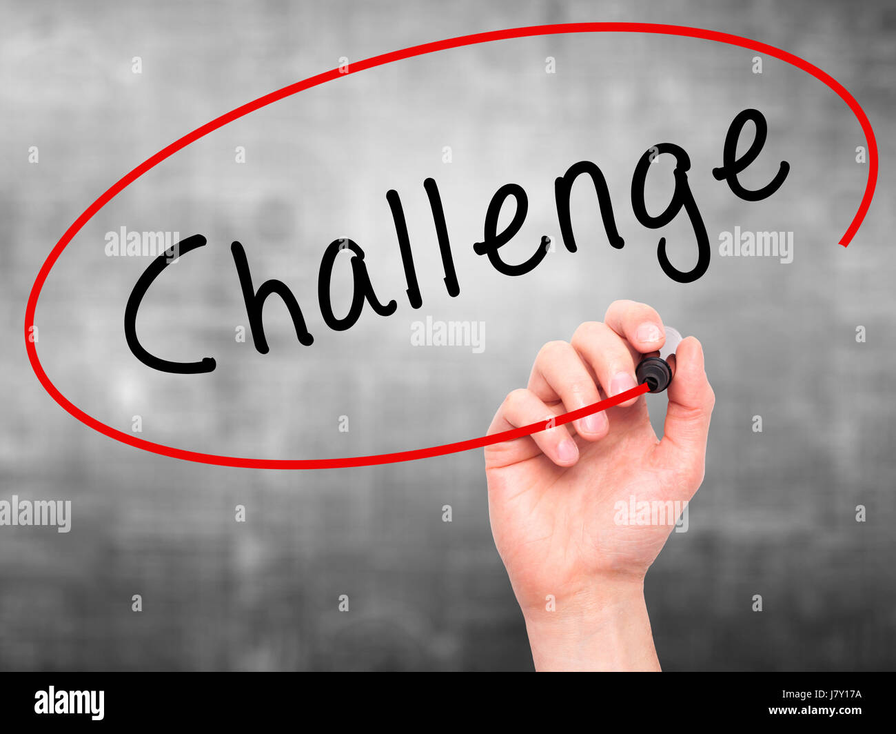 Man Hand writing Challenge with marker on transparent wipe board ...