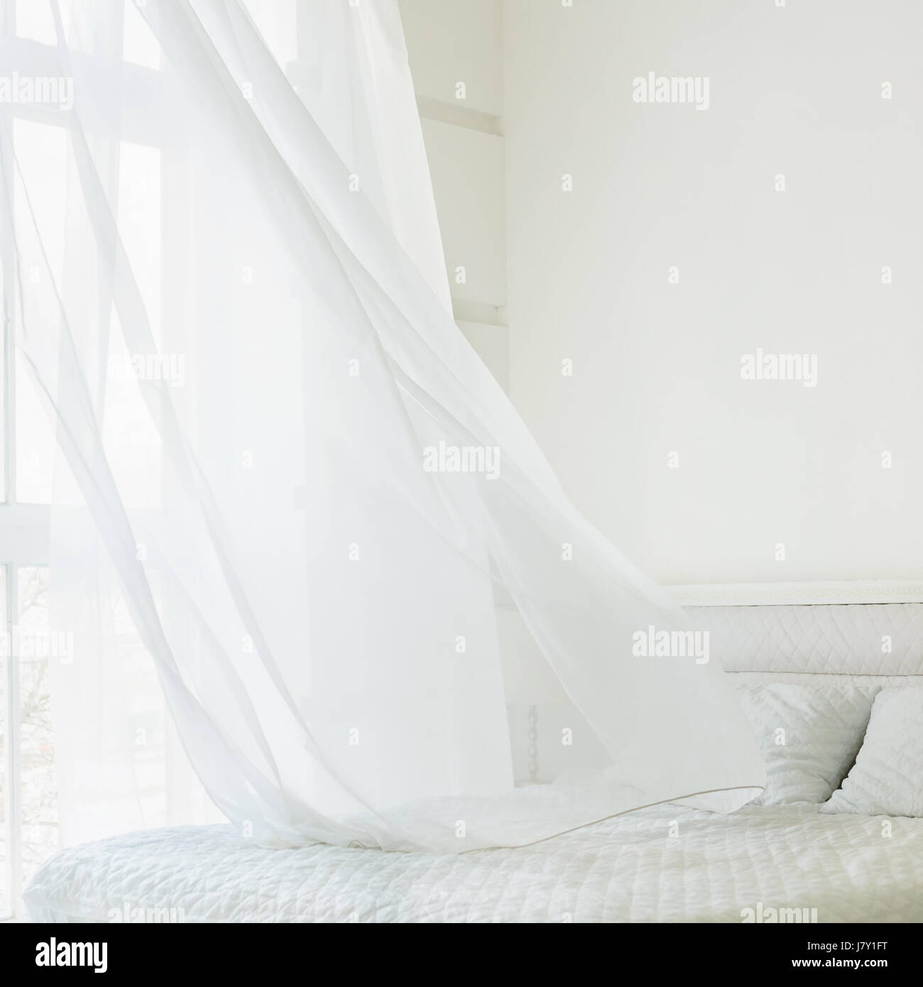 Waving curtain in bedroom Stock Photo - Alamy