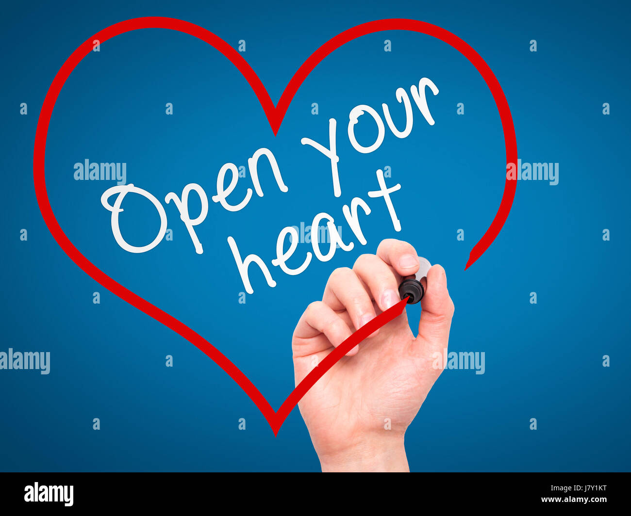 Man Hand writing Open your heart with marker on transparent wipe board ...