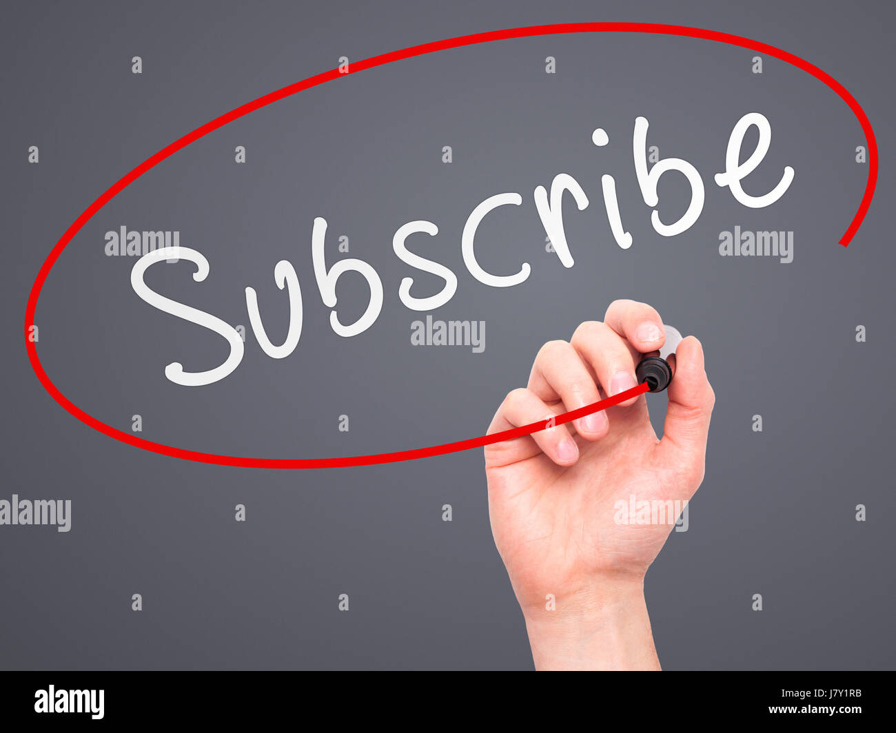 Man Hand writing Subscribe with marker on transparent wipe board ...