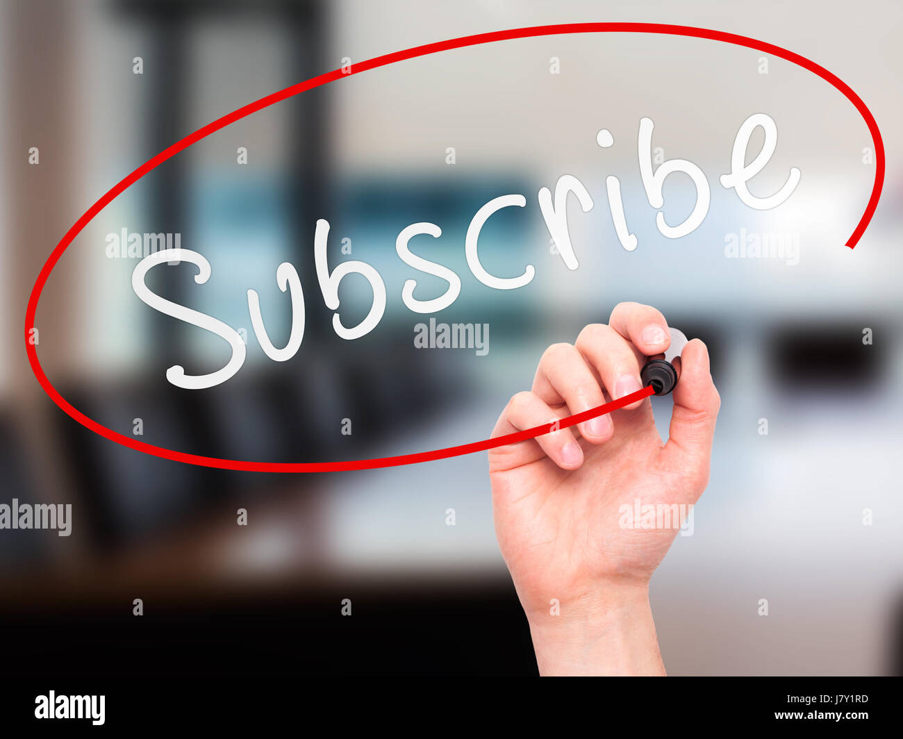 Man Hand writing Subscribe with marker on transparent wipe board ...