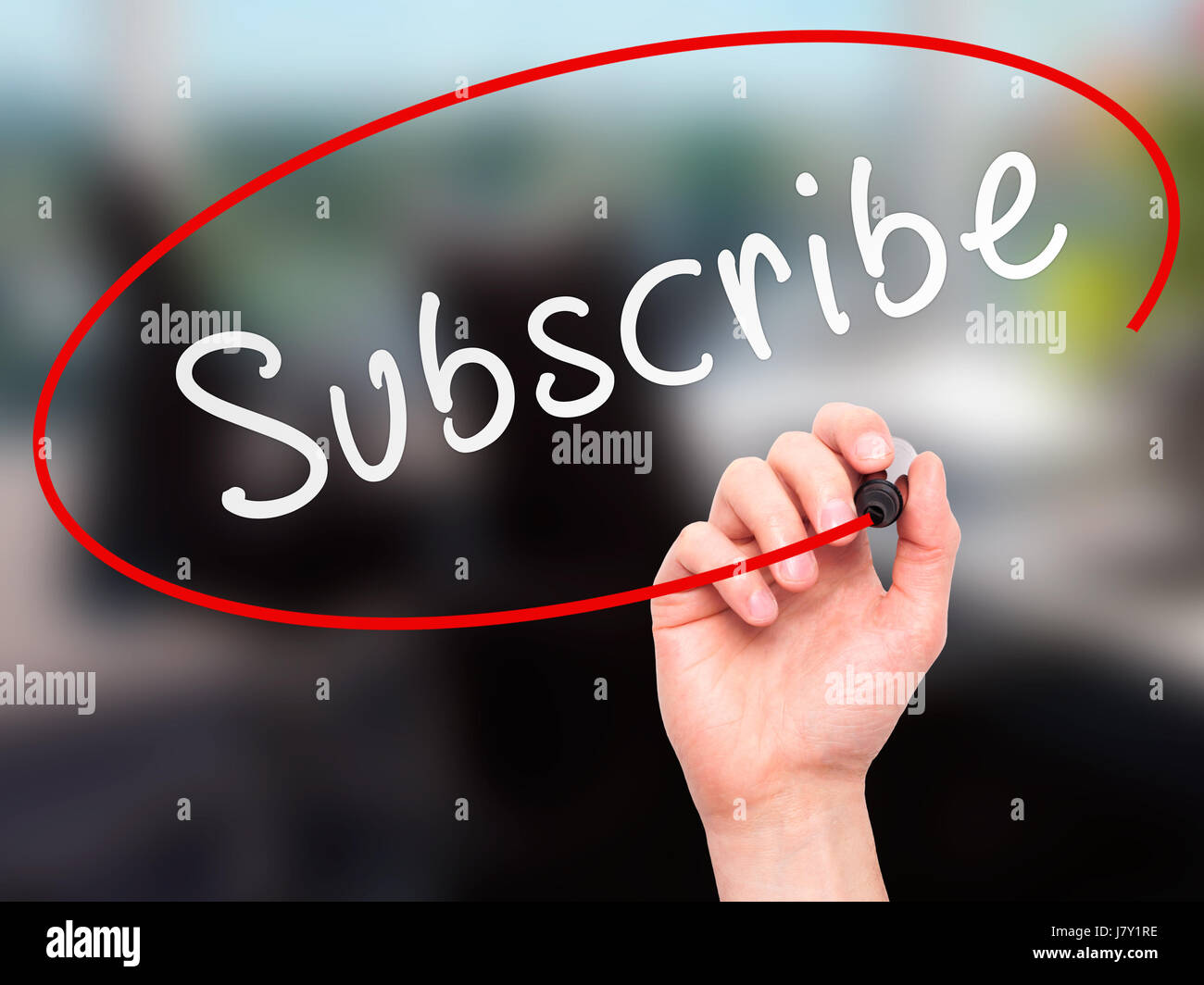 Man Hand writing Subscribe with marker on transparent wipe board ...