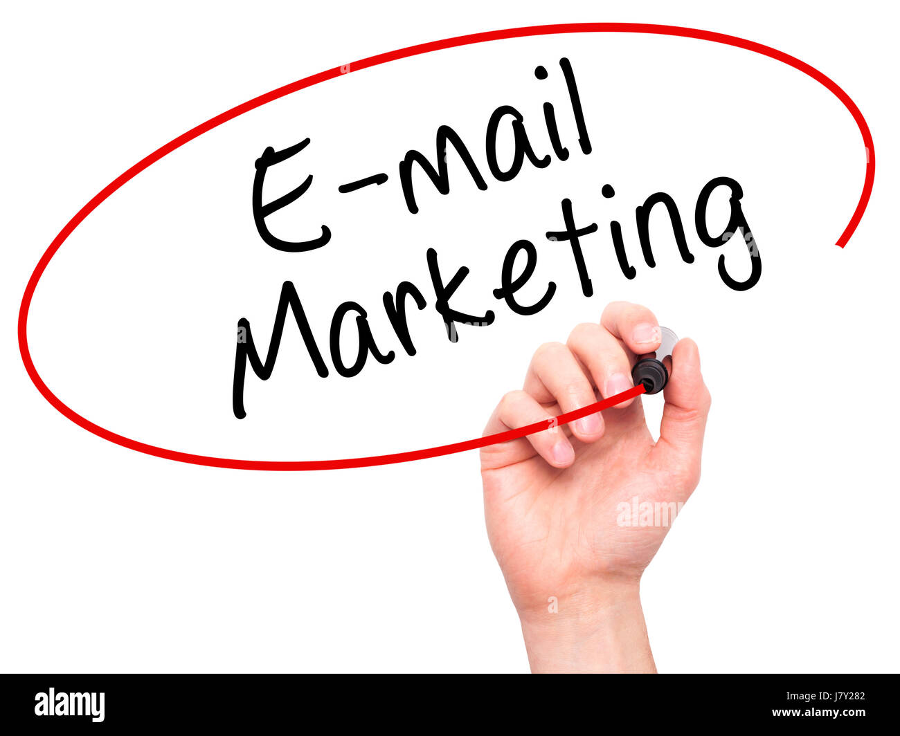 Man Hand writing E-mail Marketing with marker on transparent wipe board ...