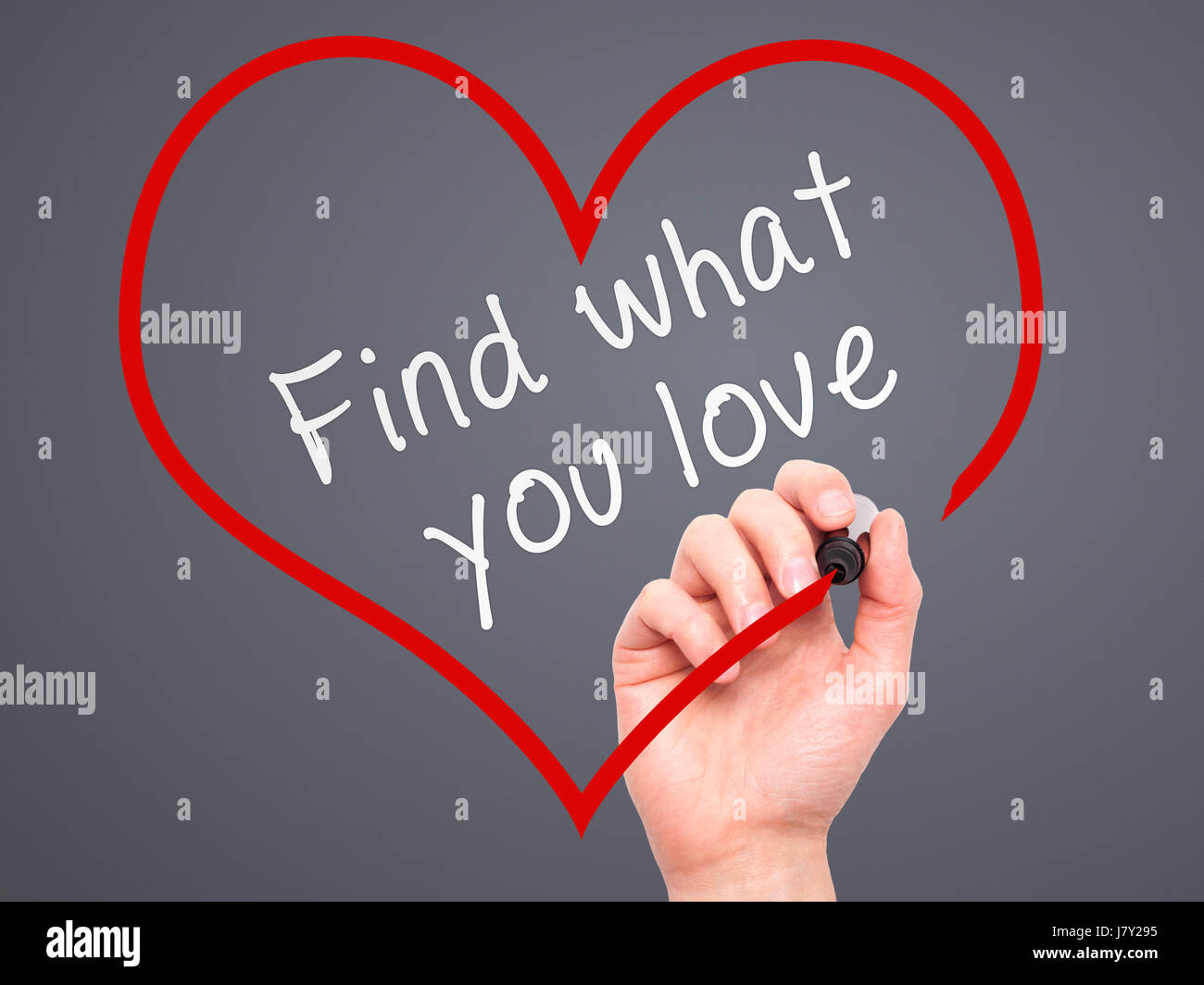 Man Hand writing Find what you love with marker on transparent wipe ...
