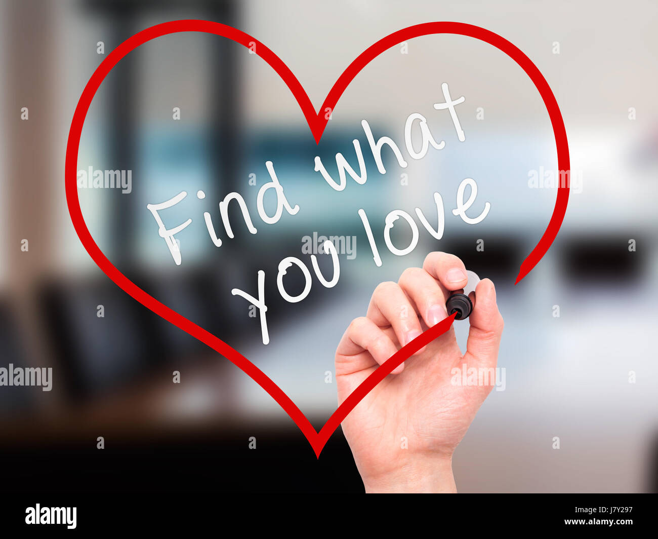 Man Hand writing Find what you love with marker on transparent wipe ...