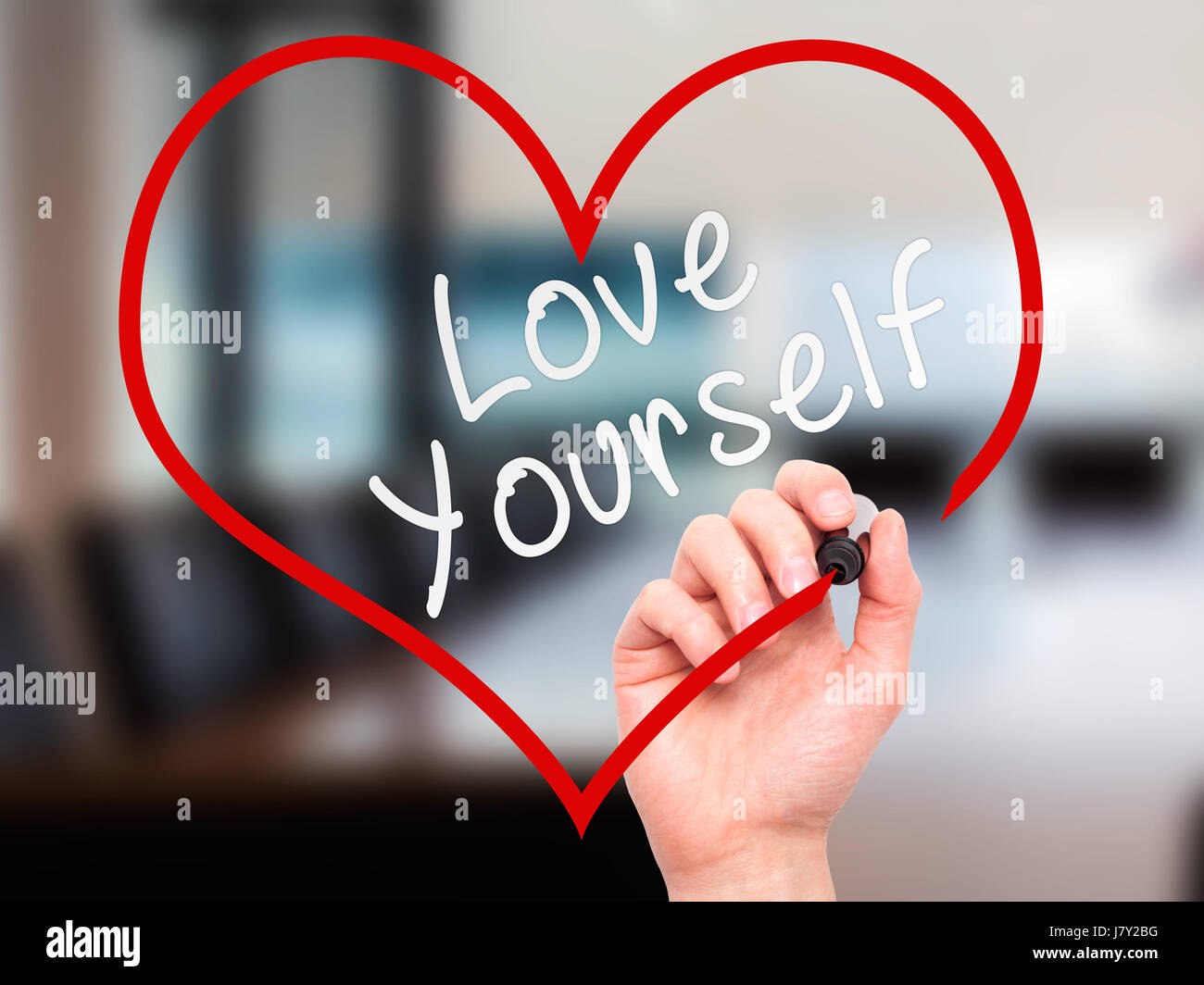 Man Hand writing Love Yourself with marker on transparent wipe board ...