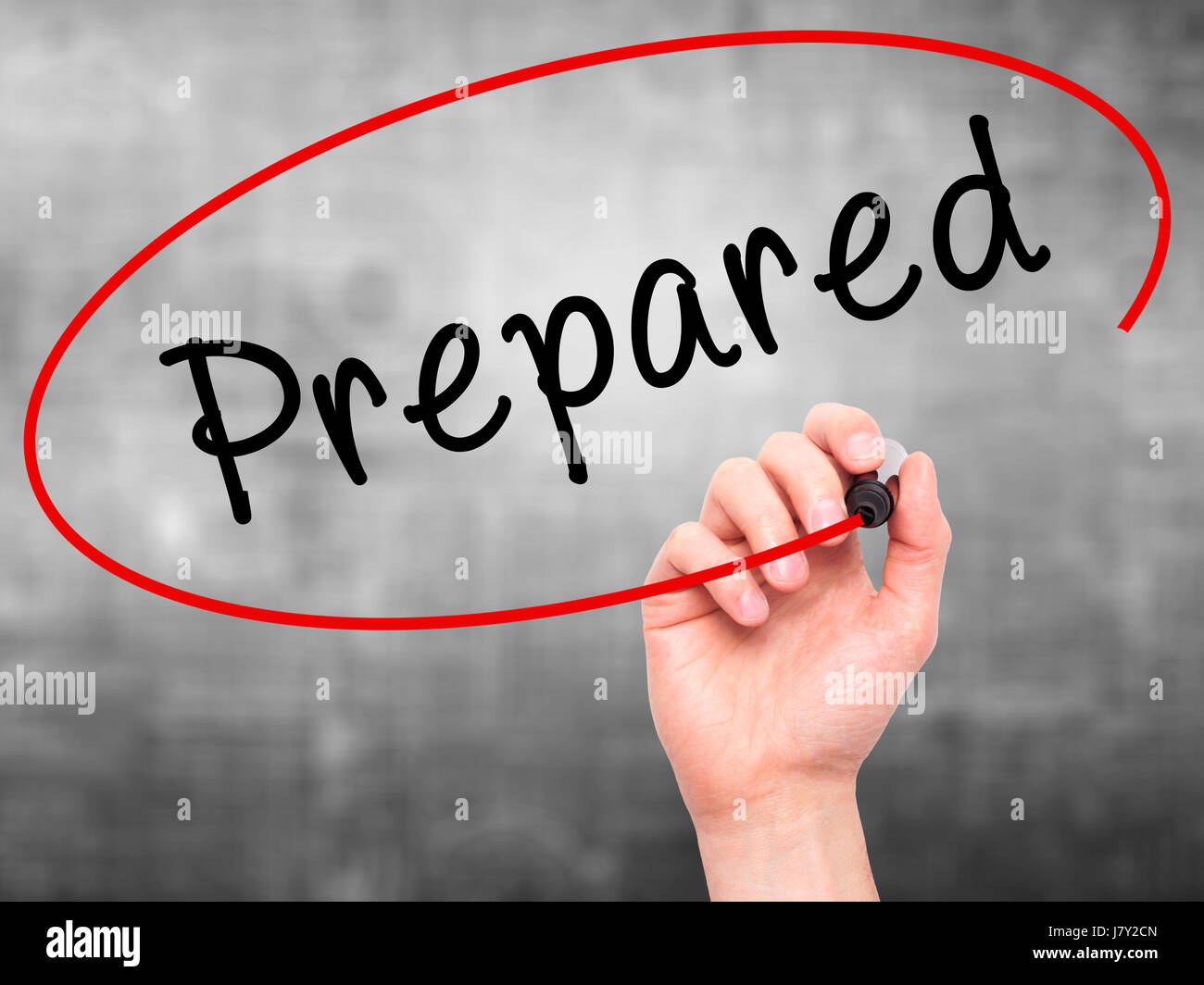 Man Hand writing Prepared with marker on transparent wipe board ...