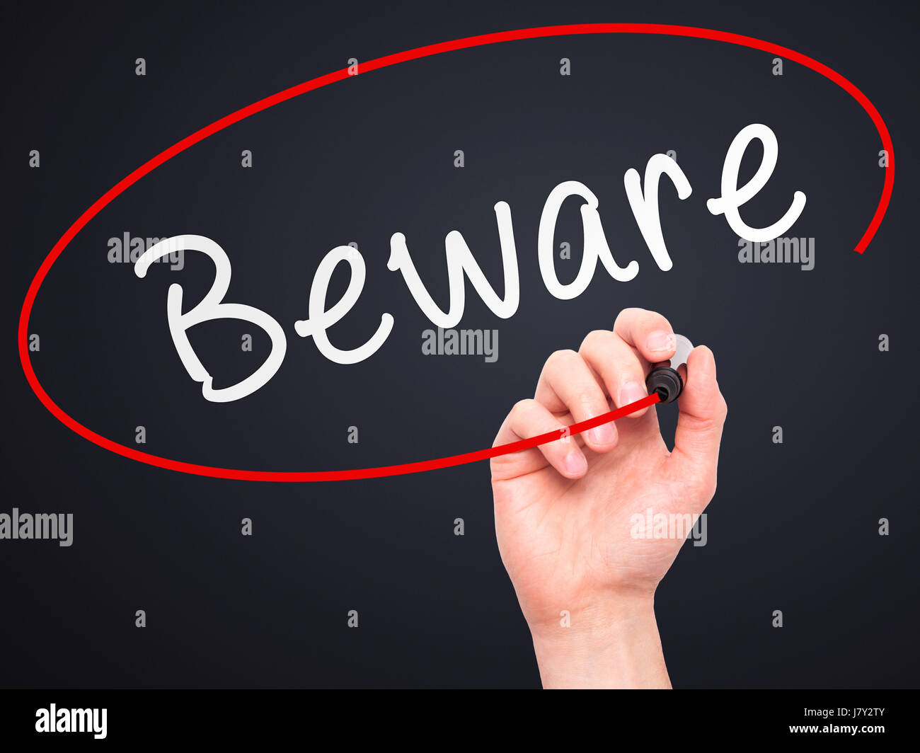 Man Hand writing Beware with marker on transparent wipe board. Isolated ...