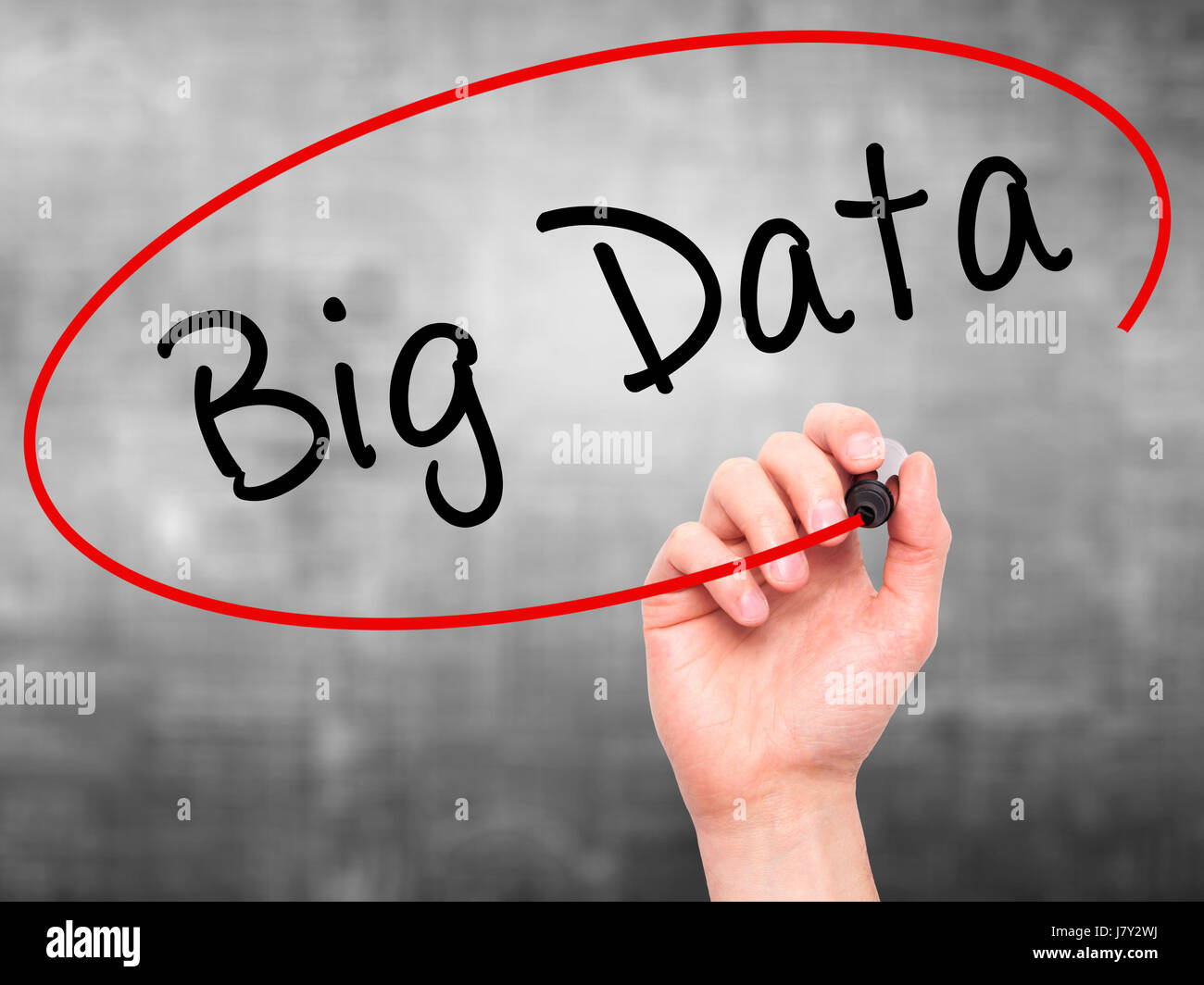 Man Hand writing Big Data with marker on transparent wipe board ...