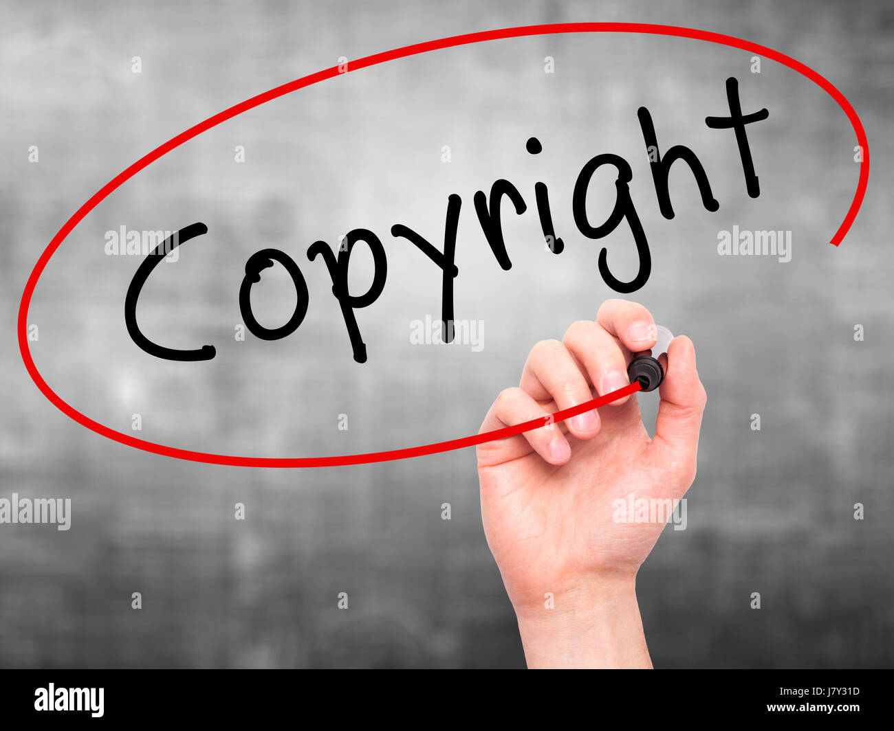 Man hand writing Copyright on visual screen. Business,help, internet ...