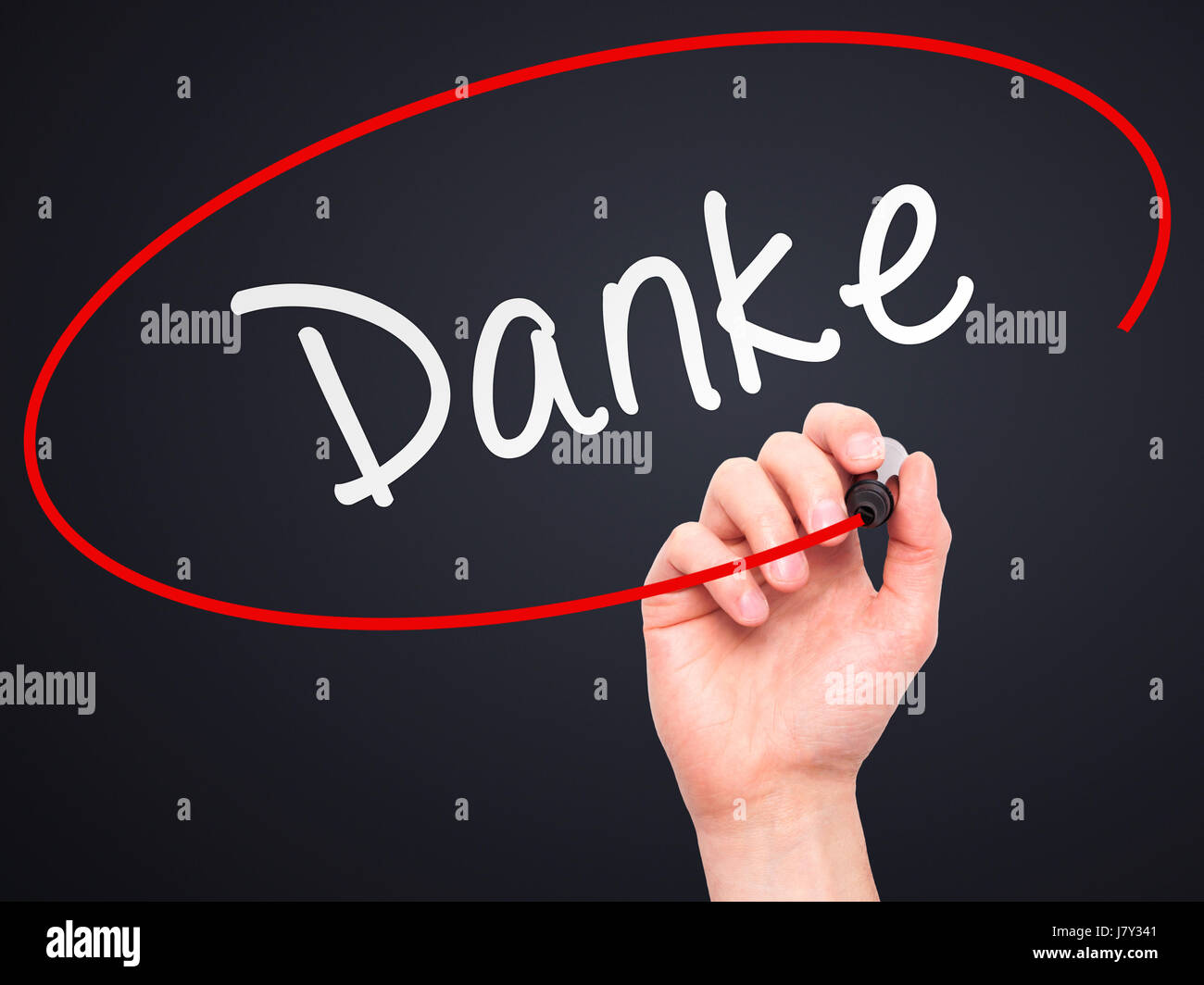 Man Hand writing Danke with marker on transparent wipe board. Isolated ...