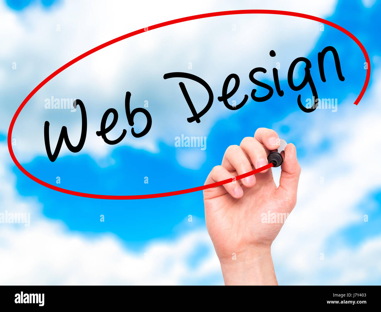 Man Hand writing Web Design with marker on transparent wipe board ...