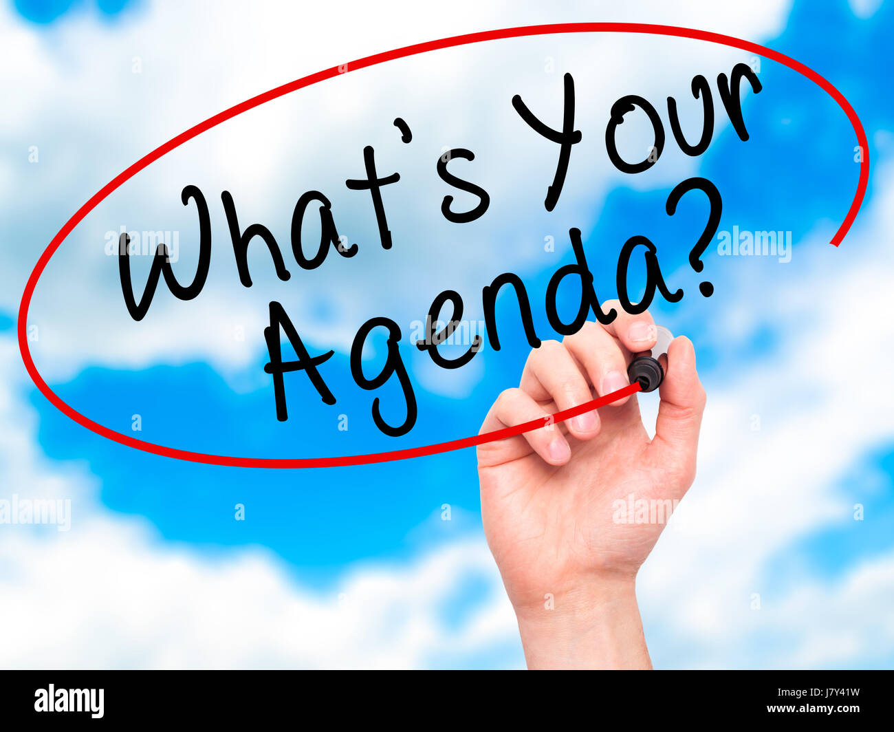 Man Hand writing What's Your Agenda with marker on transparent wipe ...