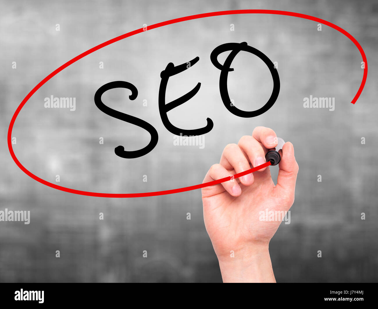 Man Hand writing SEO with marker on transparent wipe board. Isolated on ...