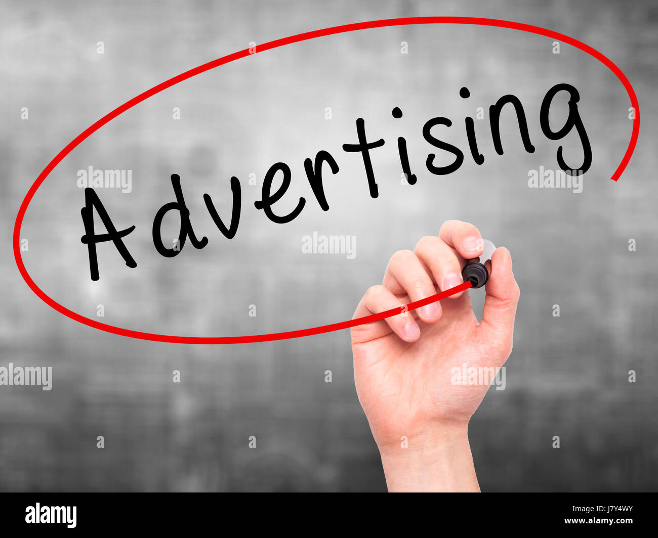 Man Hand writing Advertising with black marker on visual screen ...