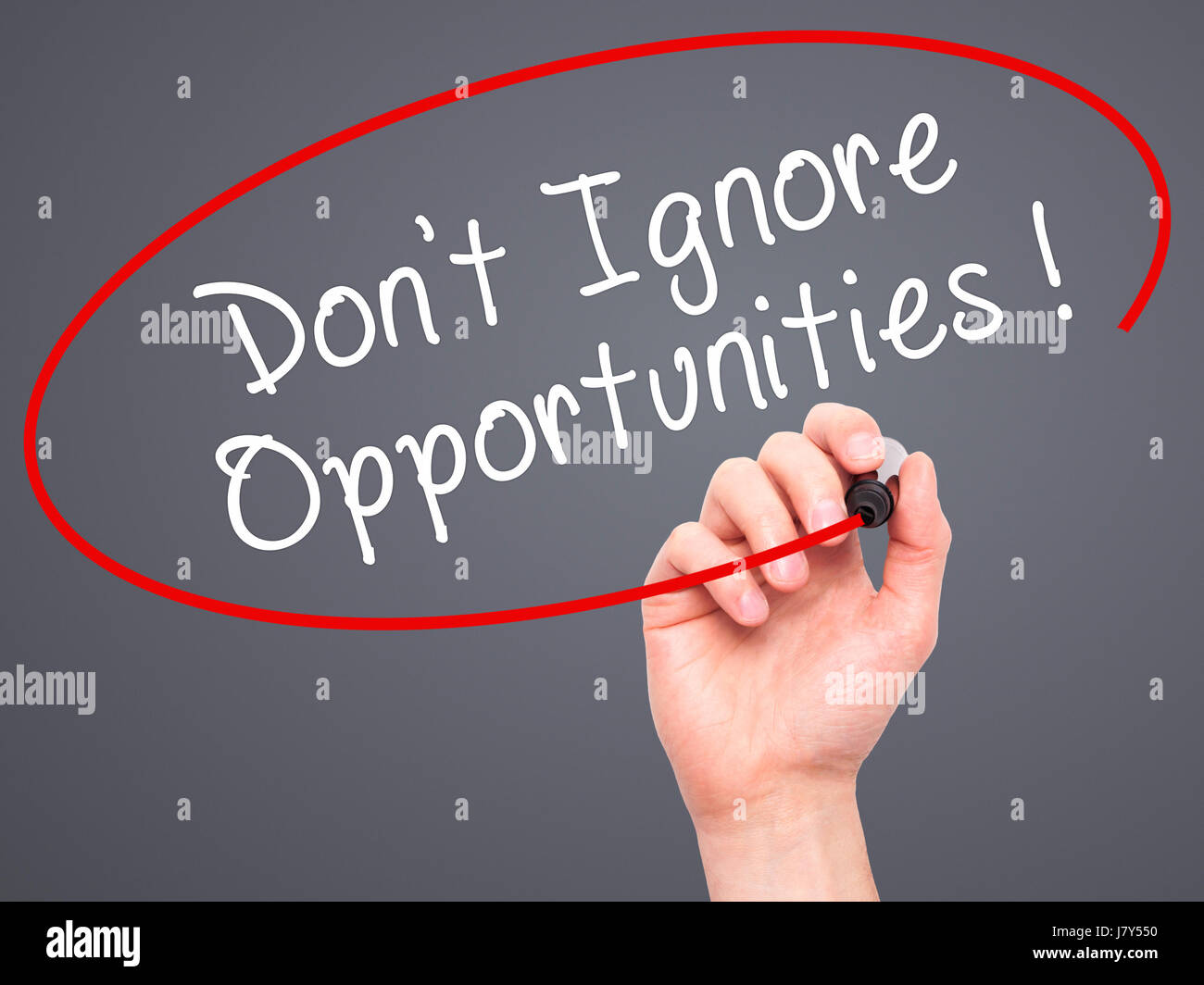 Man Hand writing Don't Ignore Opportunities black marker on visual ...