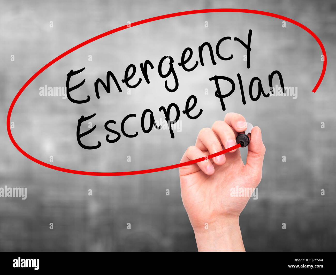 Man Hand writing Emergency Escape Plan with black marker on visual ...