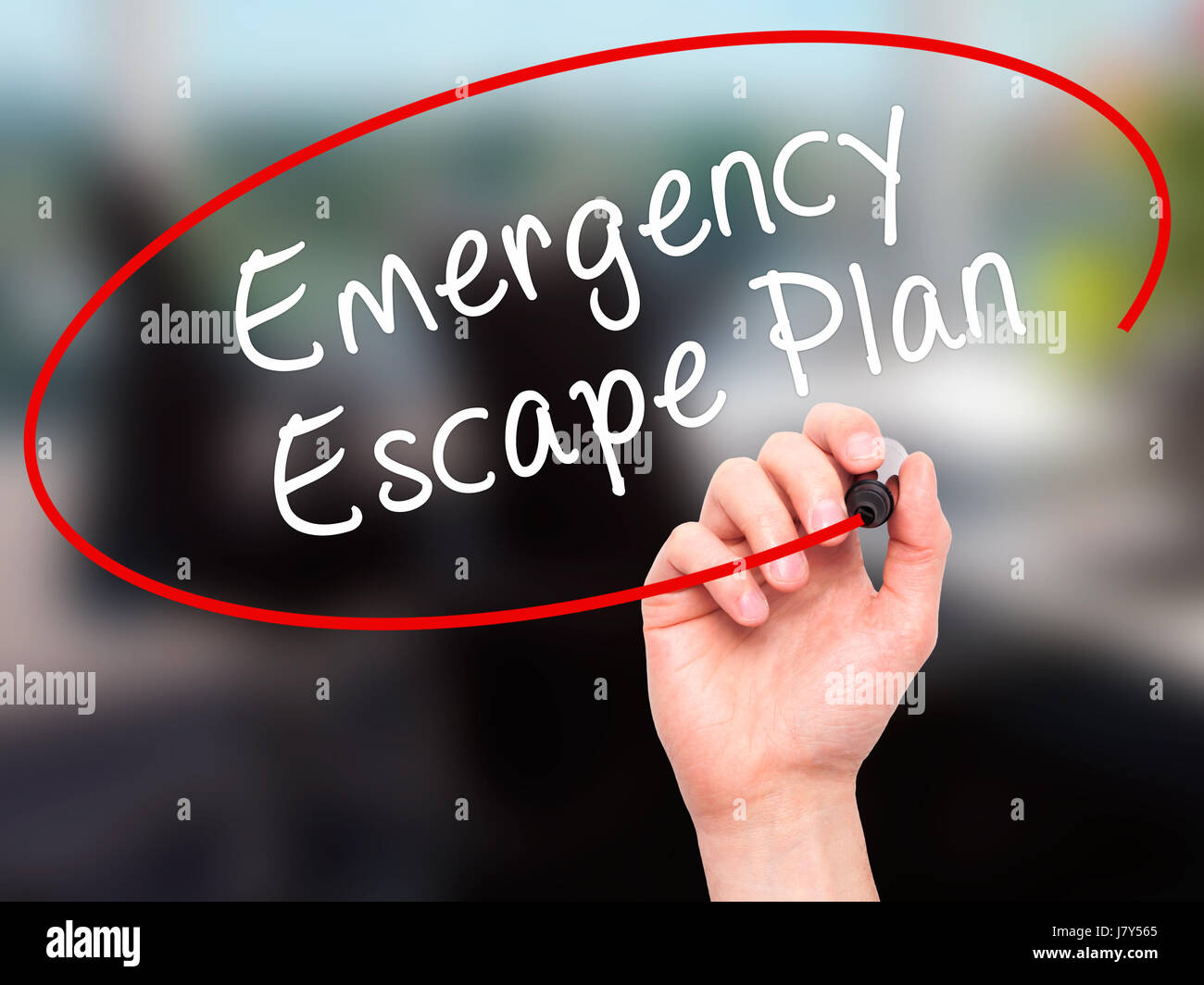 Man Hand writing Emergency Escape Plan with black marker on visual ...