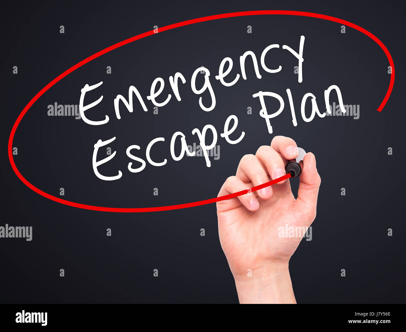 Man Hand writing Emergency Escape Plan with black marker on visual ...