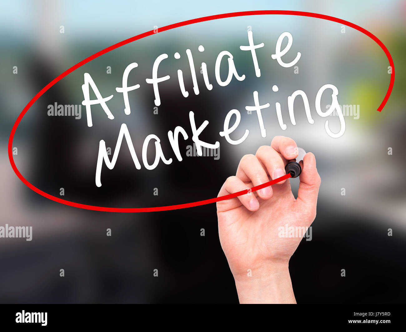 Man Hand writing Affiliate Marketing with black marker on visual screen ...