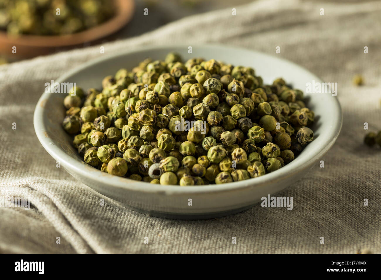 Raw Green Organic Peppercorns Ready to Cook With Stock Photo - Alamy