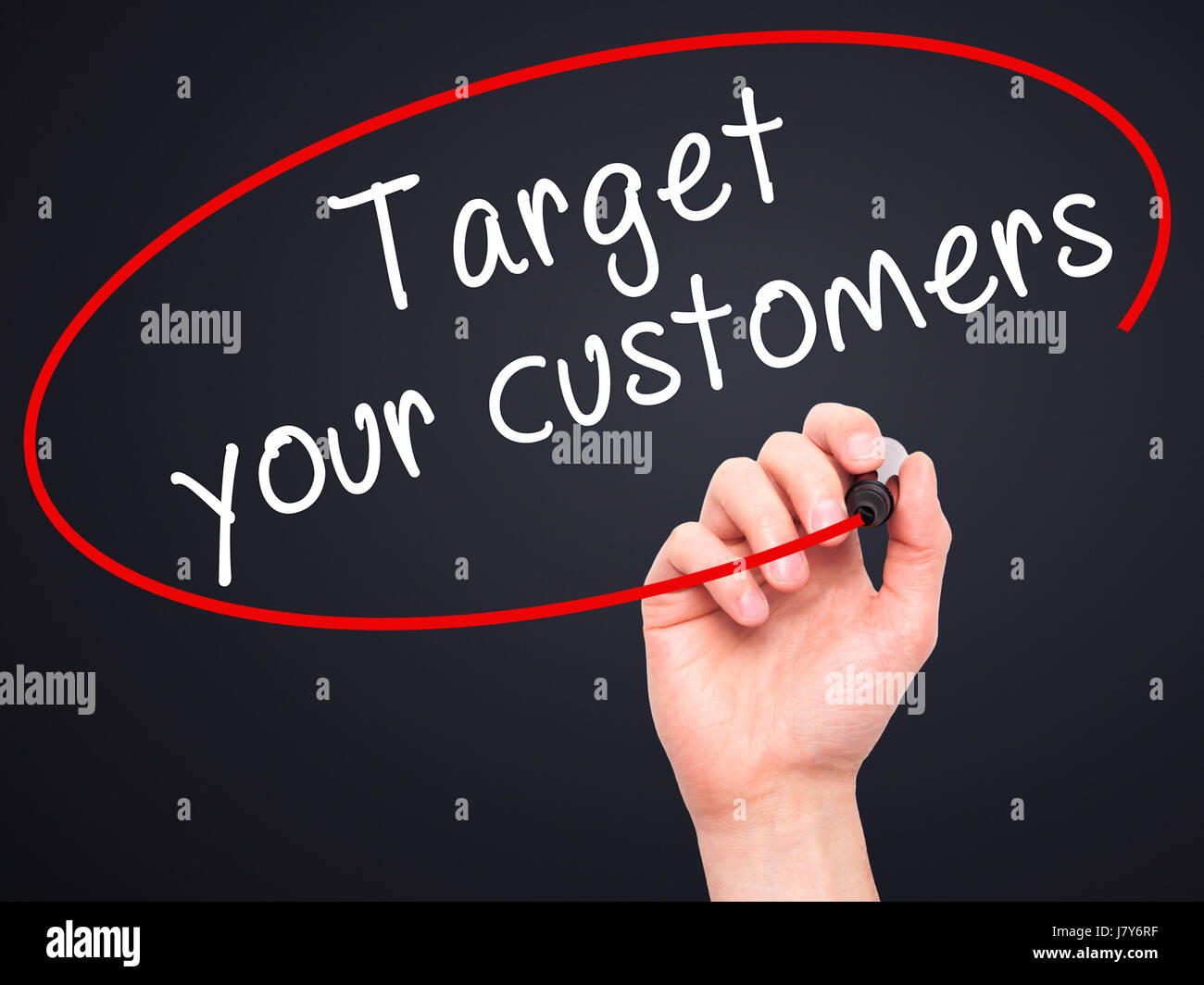 Man Hand writing Target your customers with black marker on visual ...