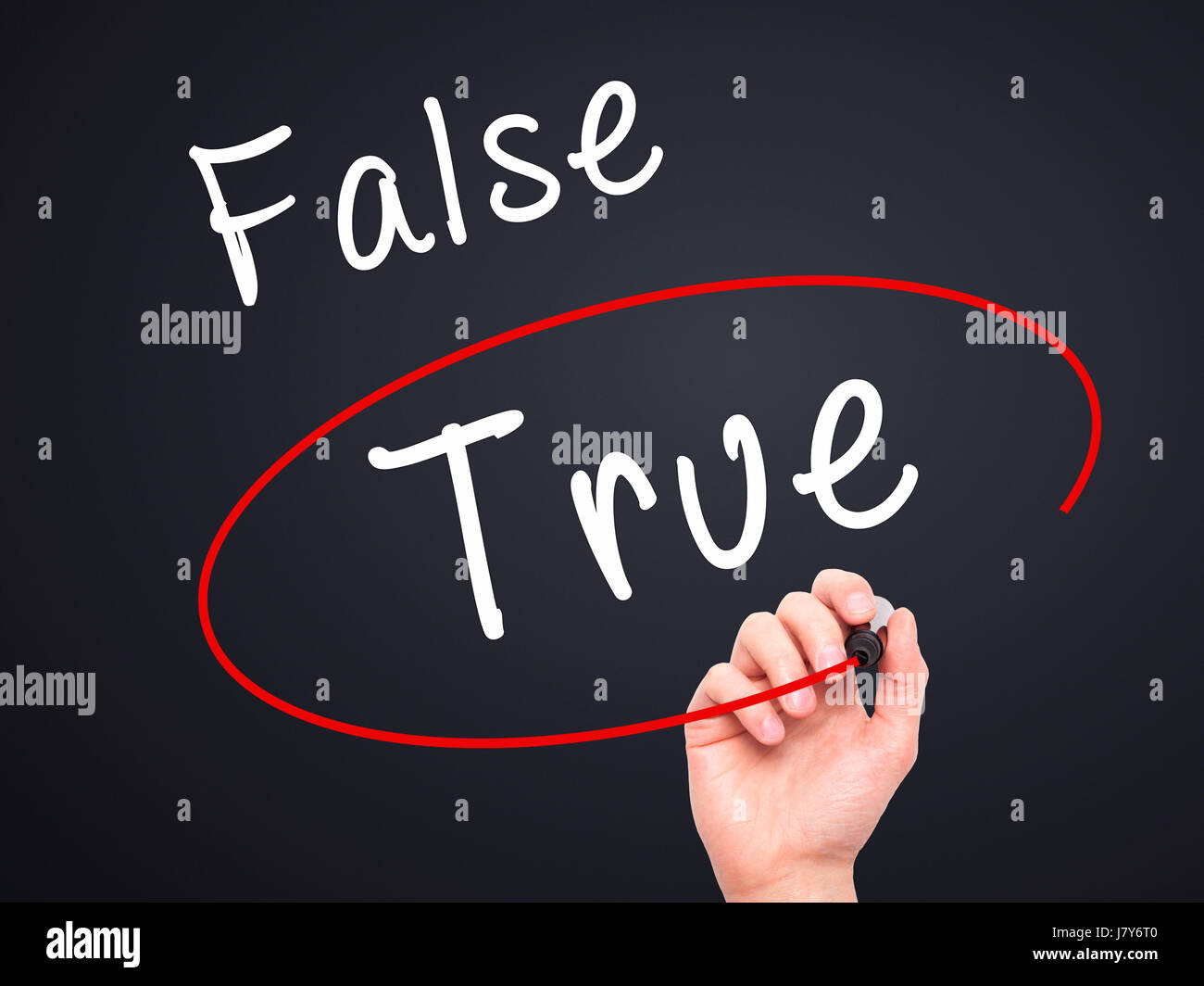 Man Hand writing an choosing True instead of False with black marker on ...