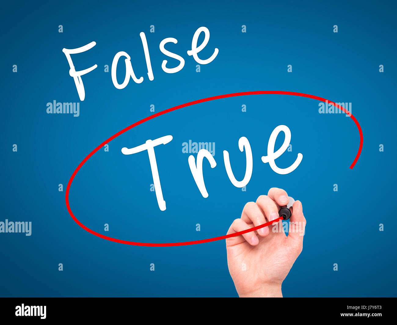 Man Hand writing an choosing True instead of False with black marker on ...