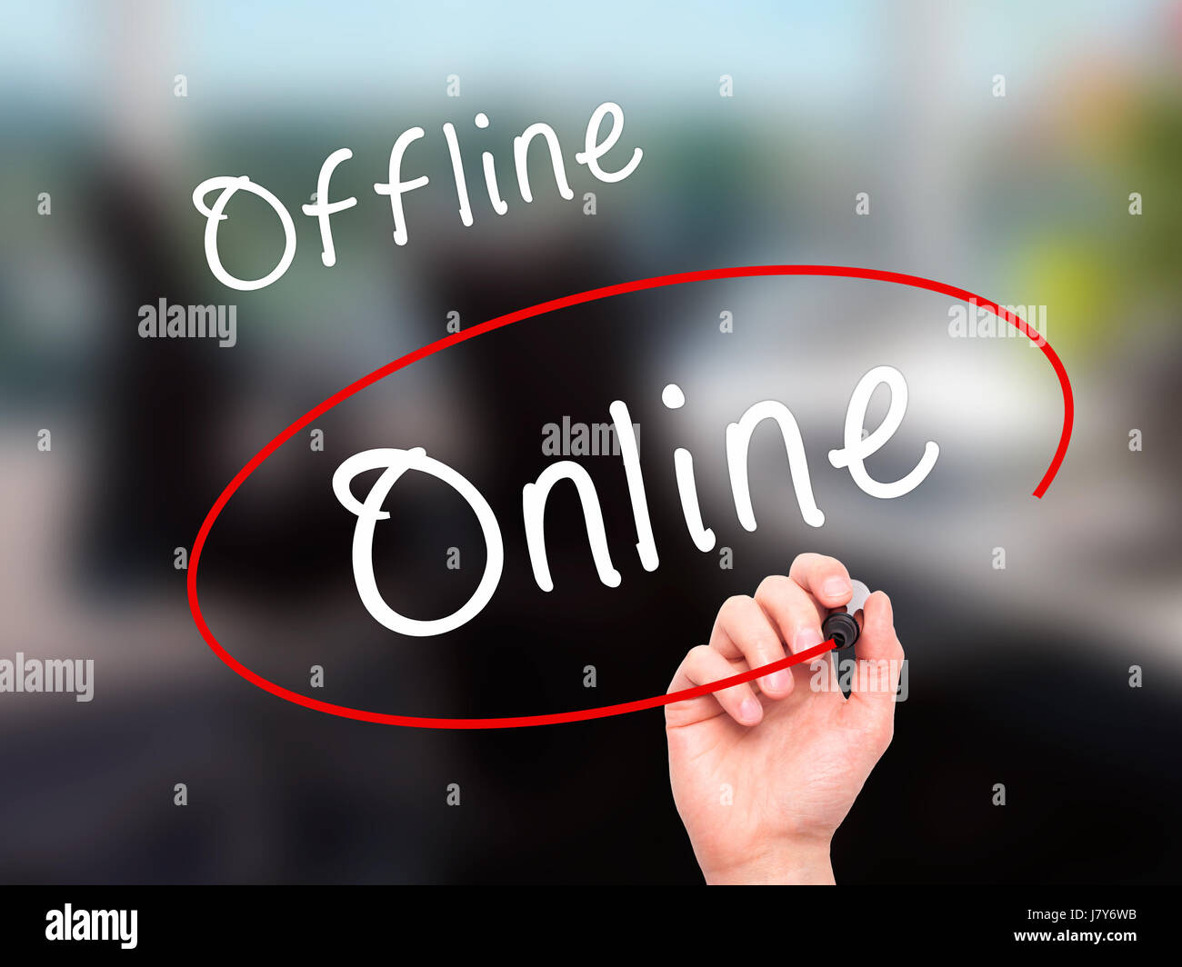 Man Hand writing and choosing Online instead of Offline with black ...