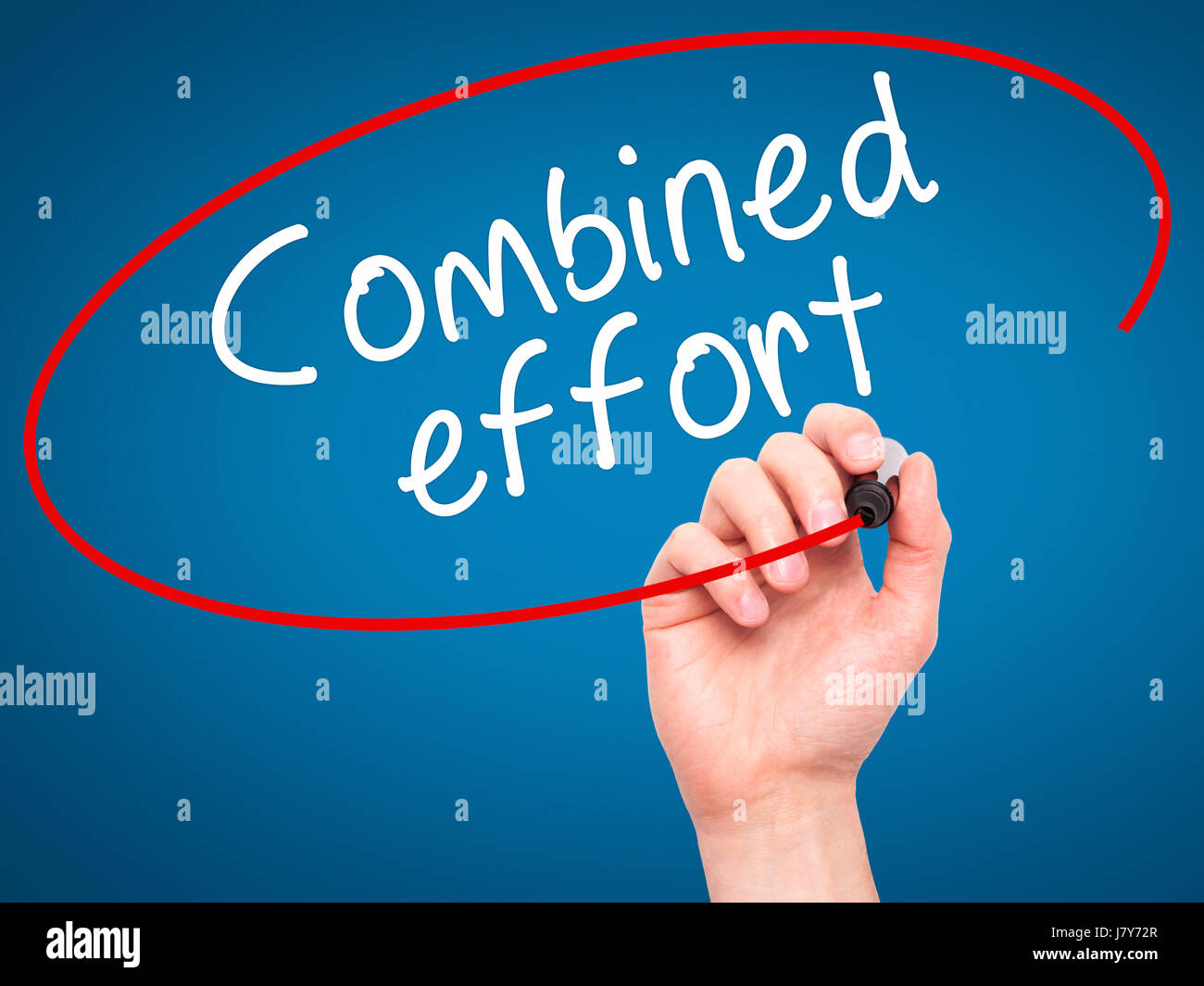 Man Hand writing Combined effort with black marker on visual screen ...