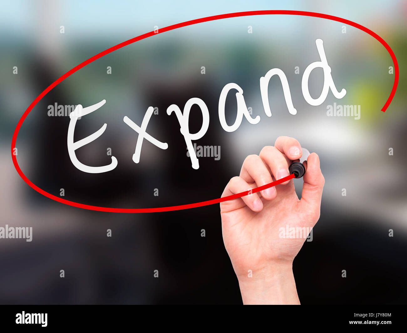 Man Hand writing Expand with marker on transparent wipe board. Isolated ...