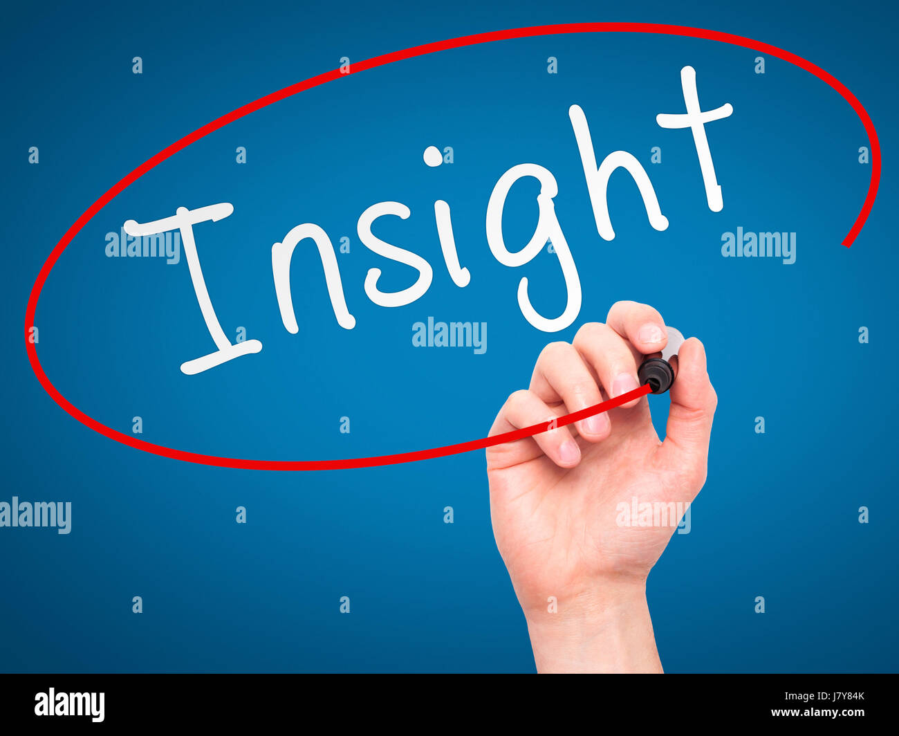 Man Hand writing Insight with marker on transparent wipe board ...