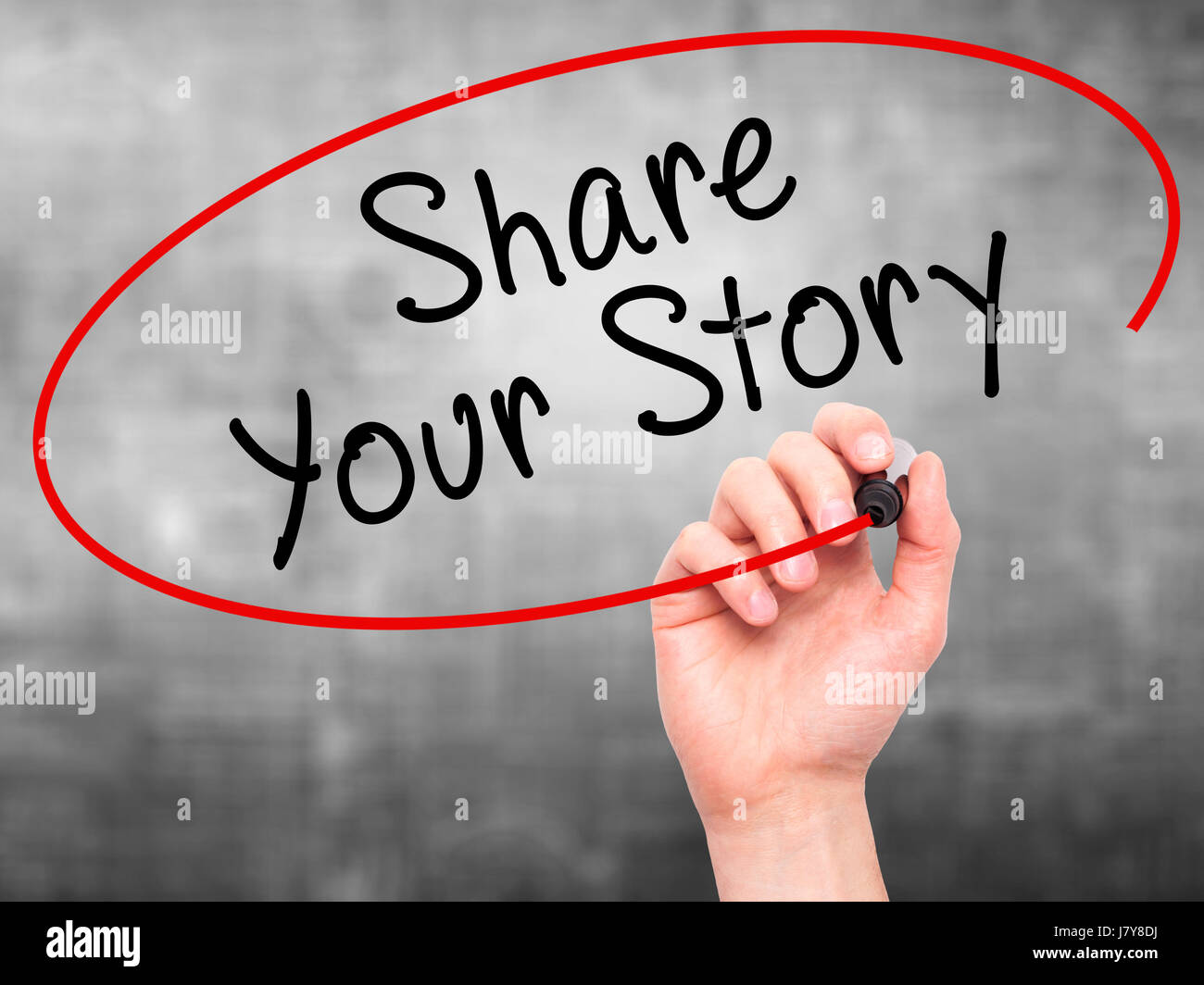 Man Hand writing Share Your Story with marker on transparent wipe board ...