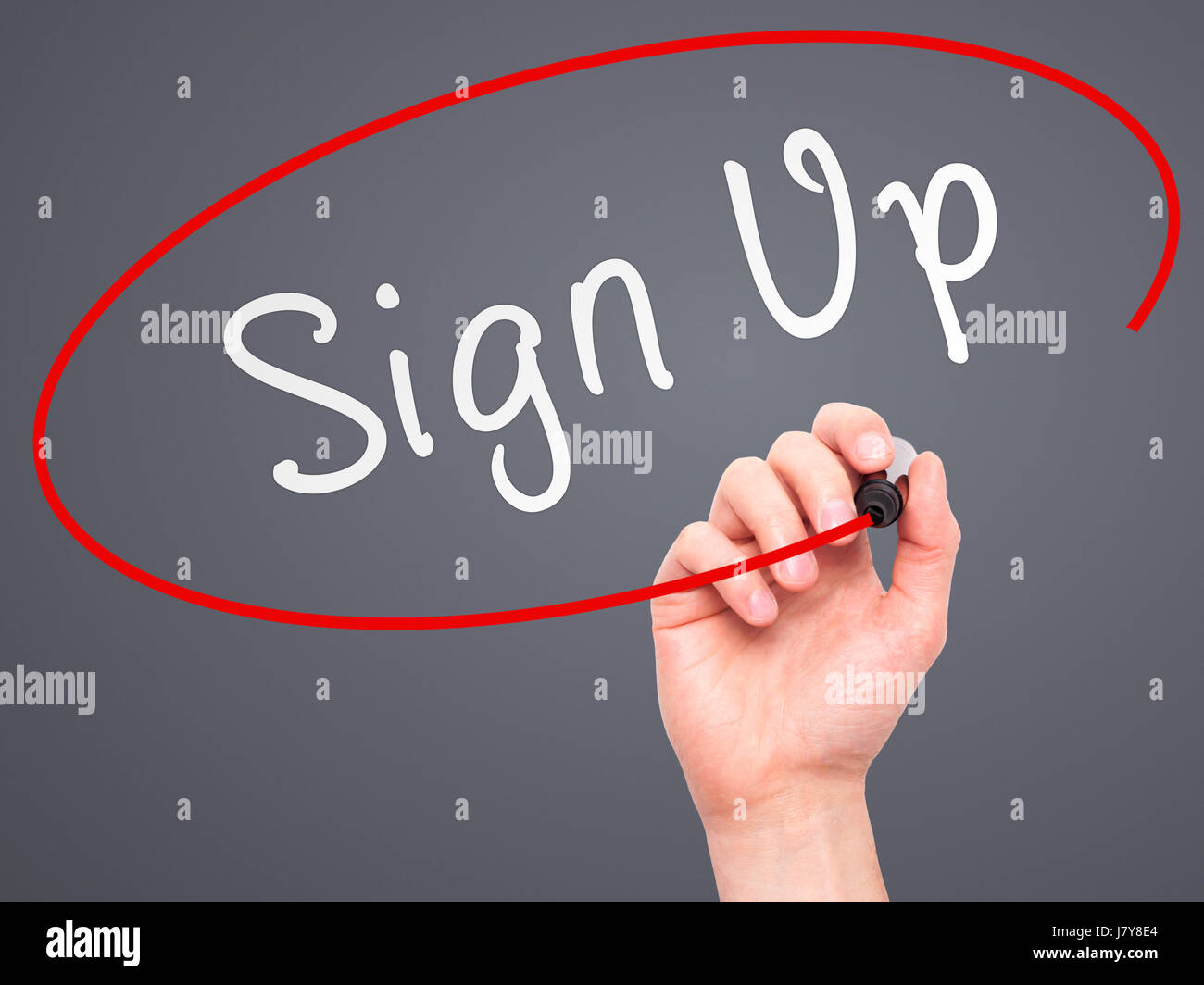 Man Hand writing Sign Up with marker on transparent wipe board ...