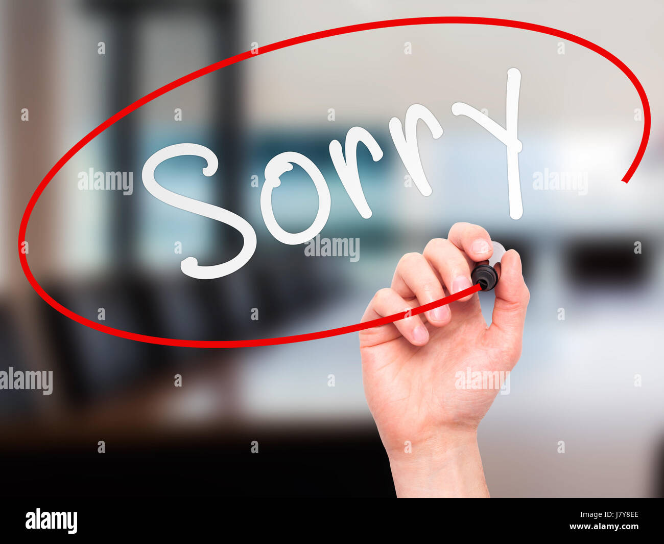 Man Hand writing Sorry with marker on transparent wipe board. Isolated ...