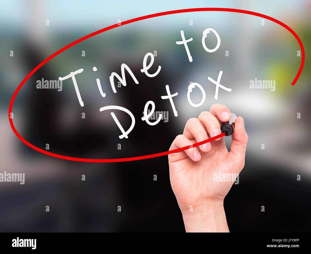 Man Hand writing Time to Detox with marker on transparent wipe board ...