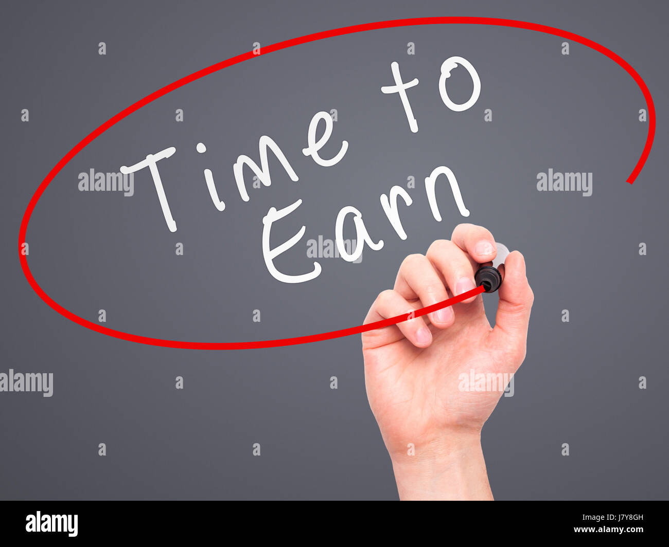 Man Hand writing Time to Earn with marker on transparent wipe board ...