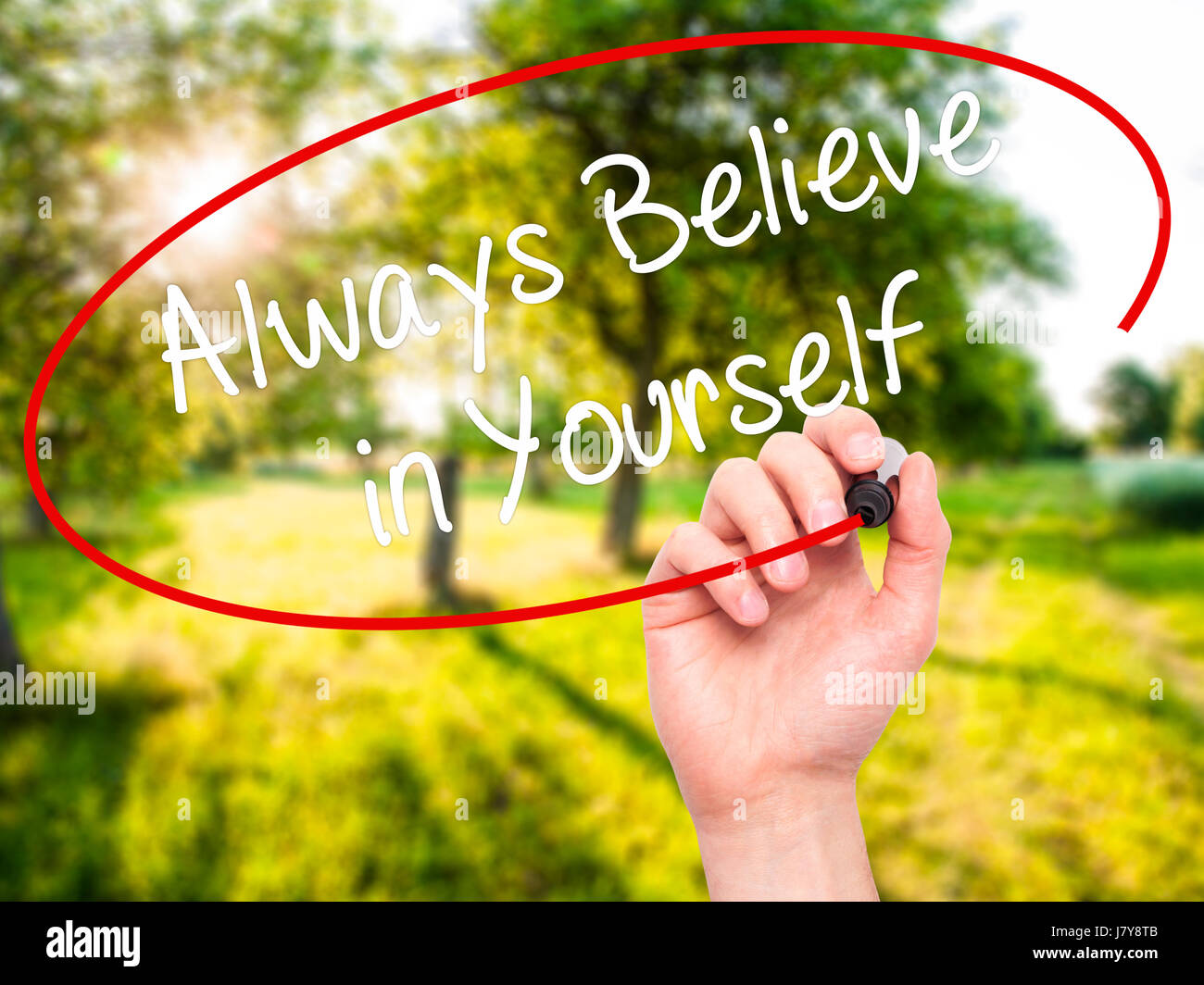 Man Hand writing Always Believe in Yourself with black marker on visual ...